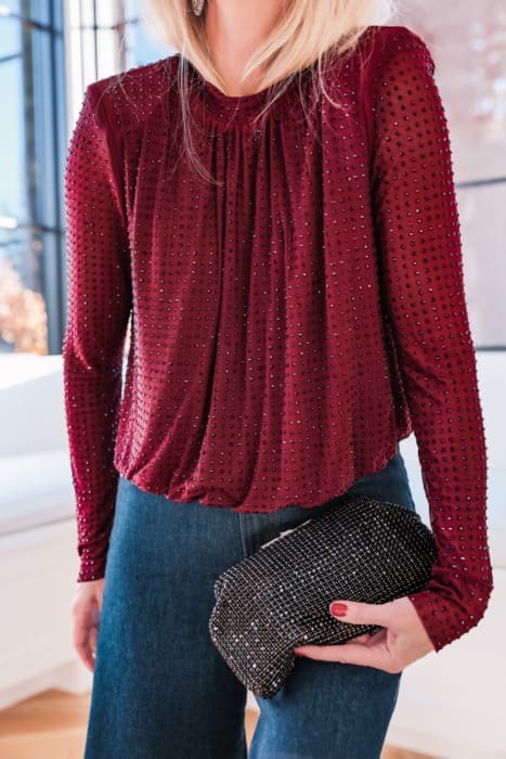 6 Chic & Affordable Holiday Tops That Look Stunning with Jeans